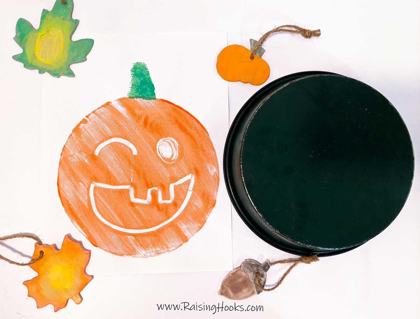 Pumpkin Faces – A Fall Press Painting Craft - Raising Hooks